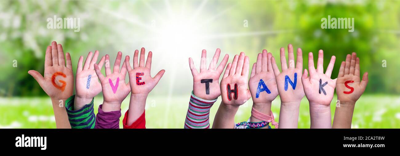 Children Hands Building Word Give Thanks, Grass Meadow Stock Photo - Alamy