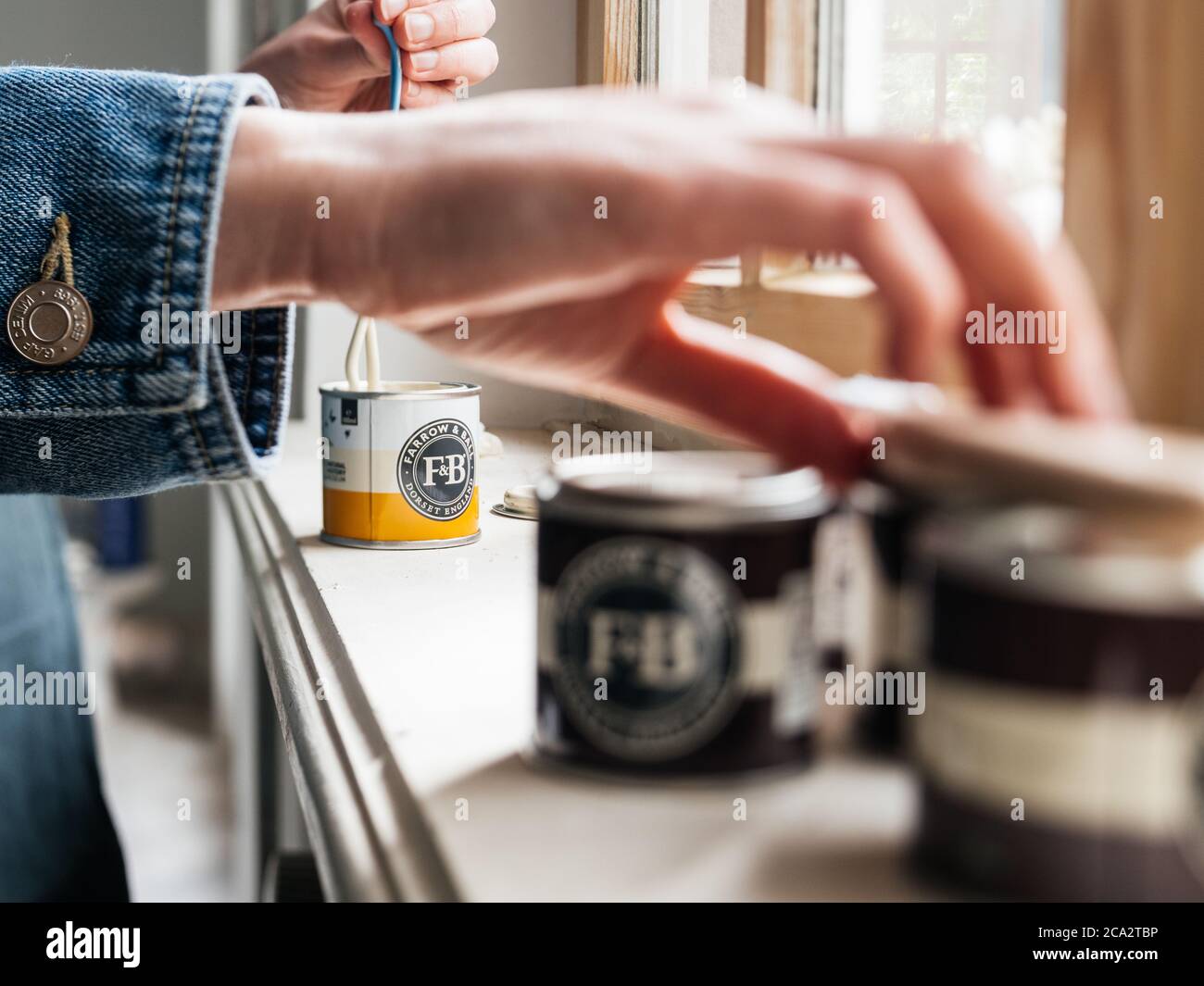 Paris, France - May 30, 2020: Close-up side view of woman testing paint ...