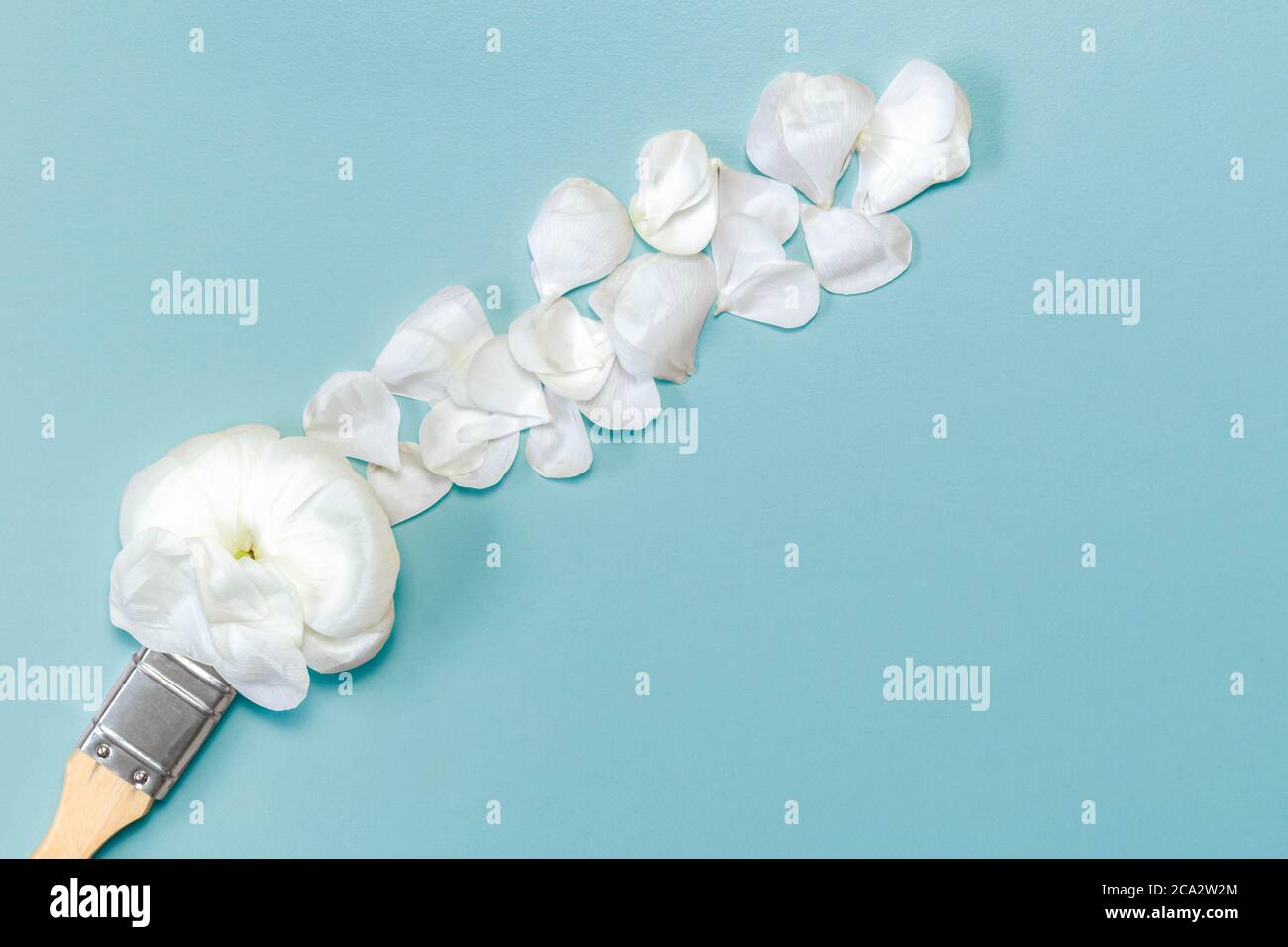 Paint brush with flower and petals. Paintbrush drawing with petals on ...
