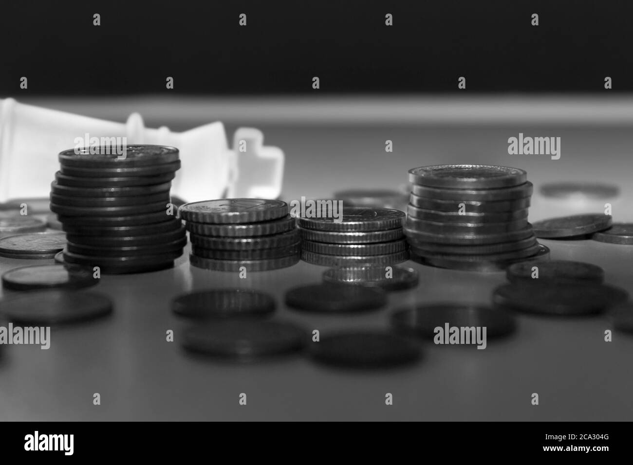 Coin stacks dark background Black and White Stock Photos & Images - Alamy