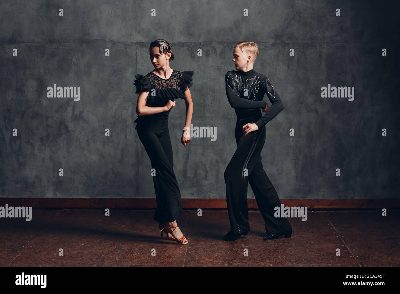 Young couple dancing in ballroom dance cha-cha-cha Stock Photo - Alamy