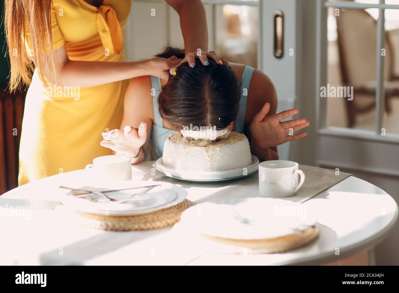 Face in cake hi-res stock photography and images - Alamy