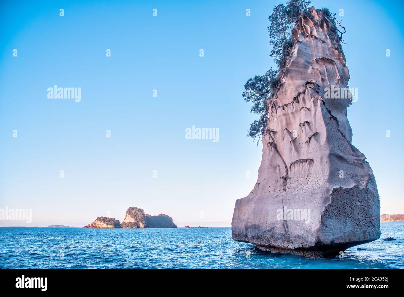 Sunset view of Cathedral Cove, rock formation above the sea, New ...