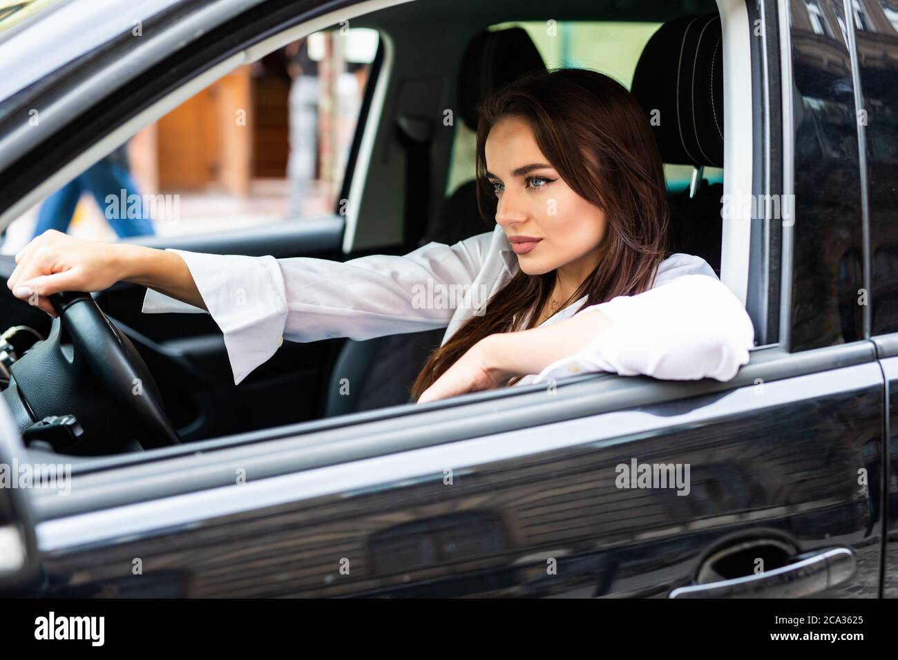 Beautiful Smiling woman driving car, attractive girl sitting in ...