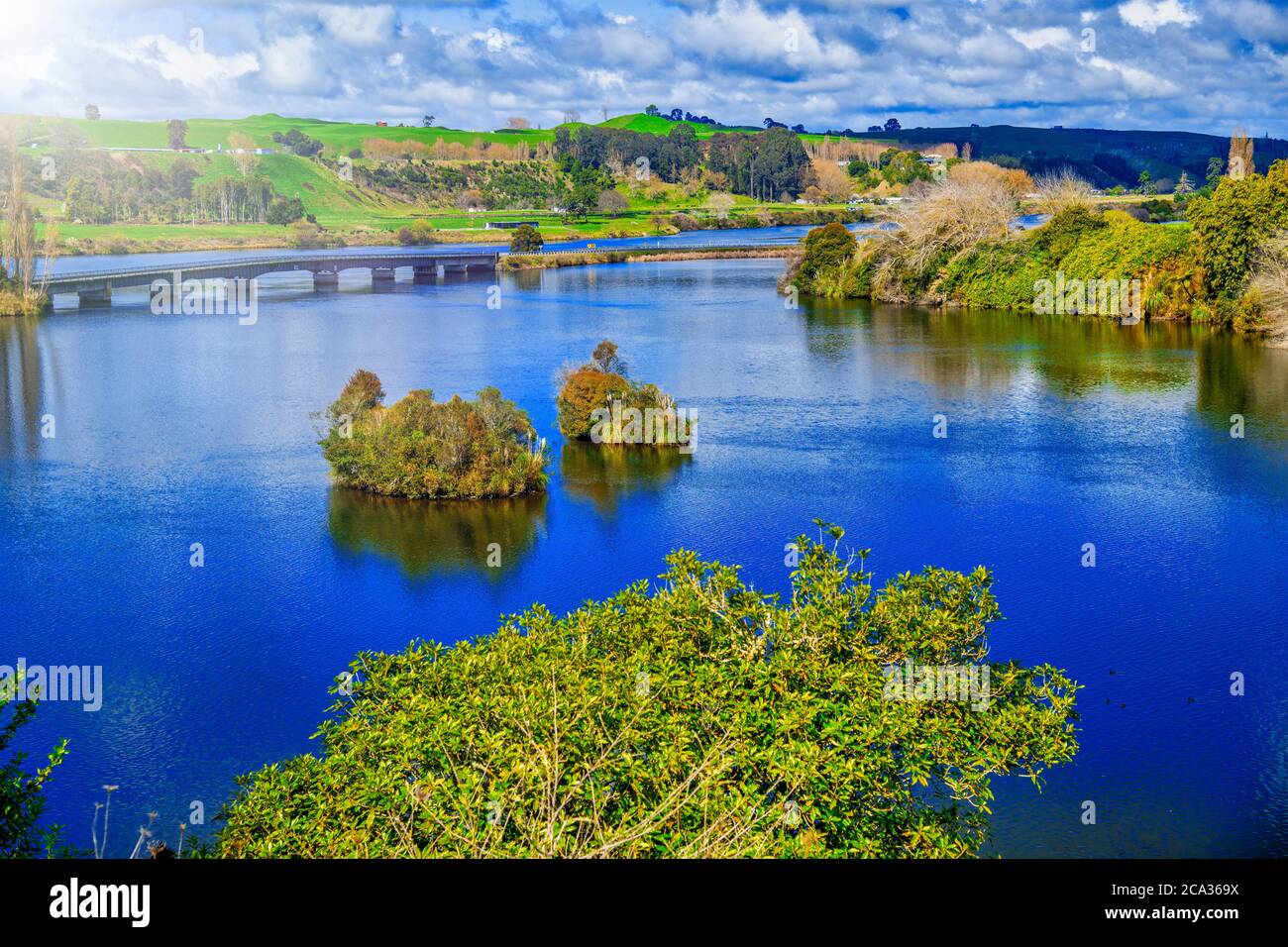 Beautiful river and hills of New Zealand on a sunny day Stock Photo - Alamy