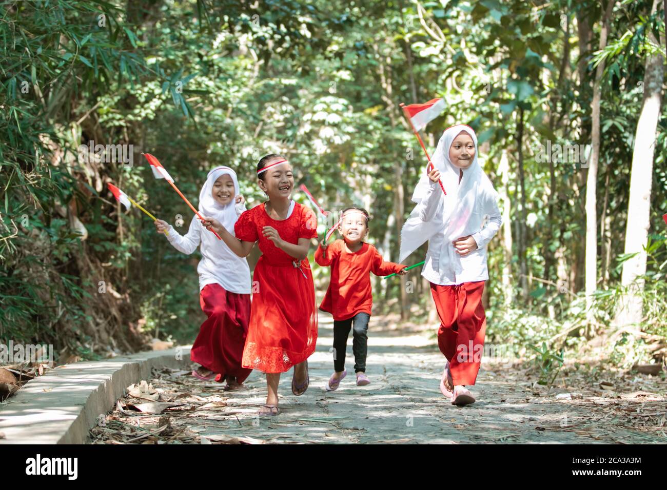 group of little girls running chasing each other when holding small the ...