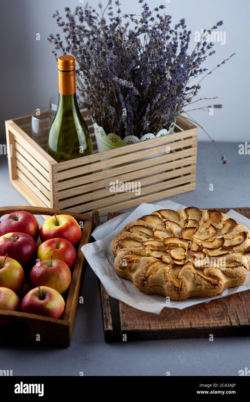 Apple pie and apples. Round homemade cake. Simple pastry made from ...