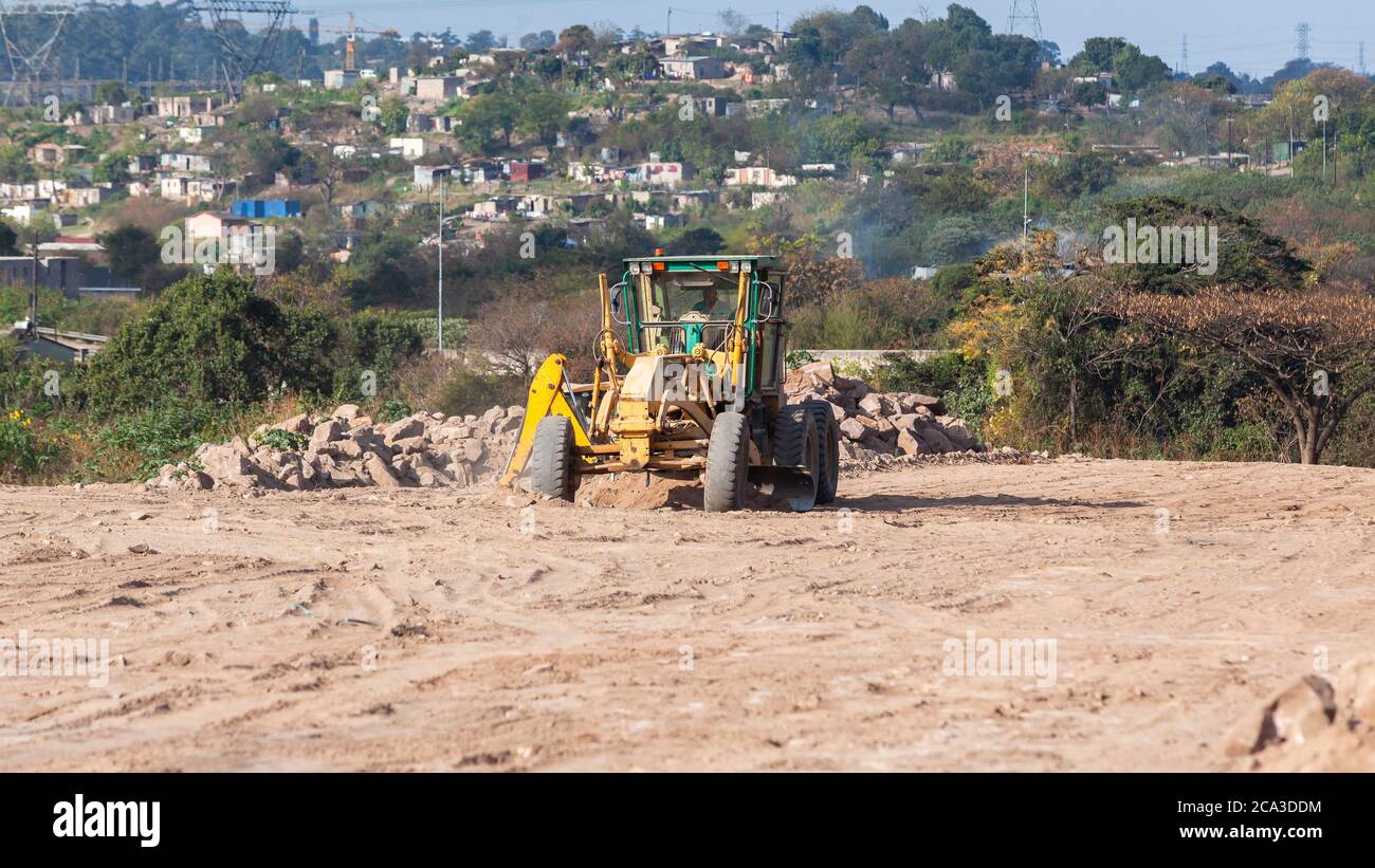 Industrial construction development earthworks site with grader roller ...