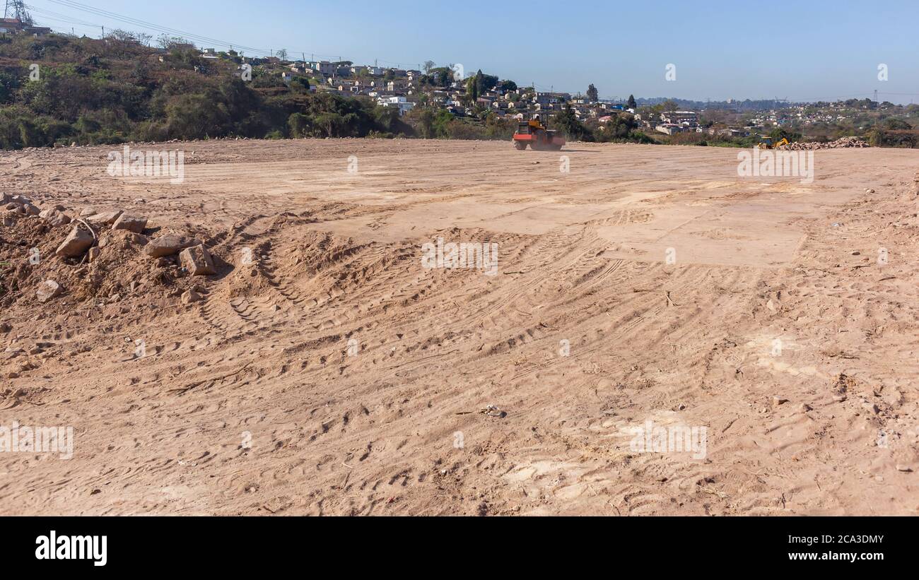 Industrial construction development earthworks site with grader roller ...