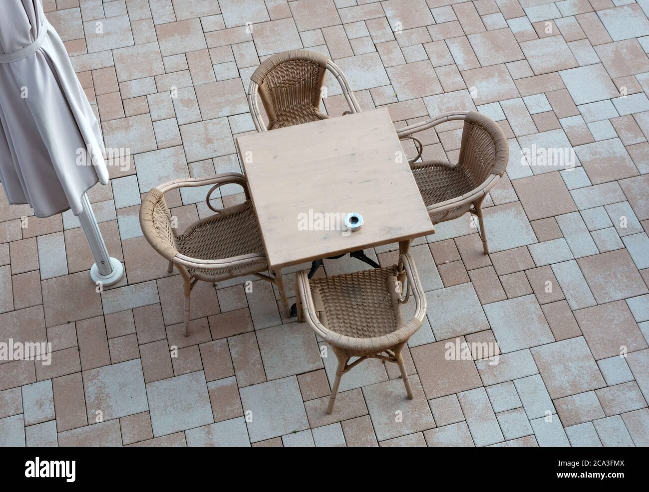 Cafe terrace with empty tables and chairs Stock Photo - Alamy