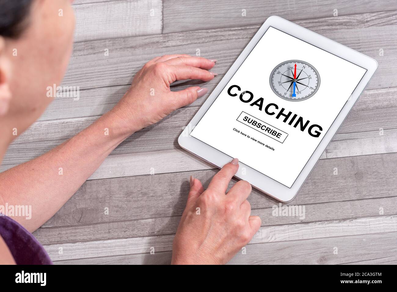 Woman using a tablet showing coaching concept Stock Photo - Alamy