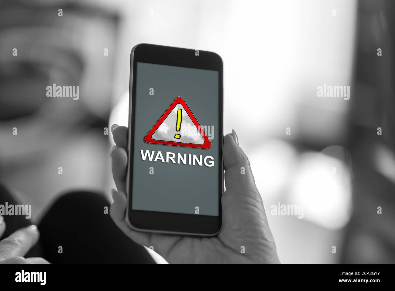 Smartphone screen displaying a warning concept Stock Photo - Alamy