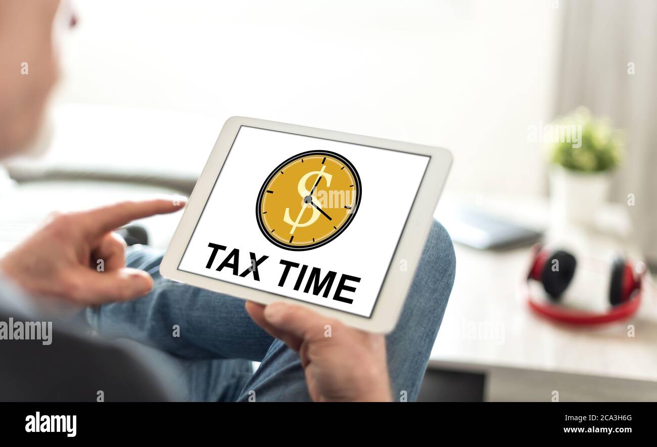 Tablet screen displaying tax hi-res stock photography and images - Alamy