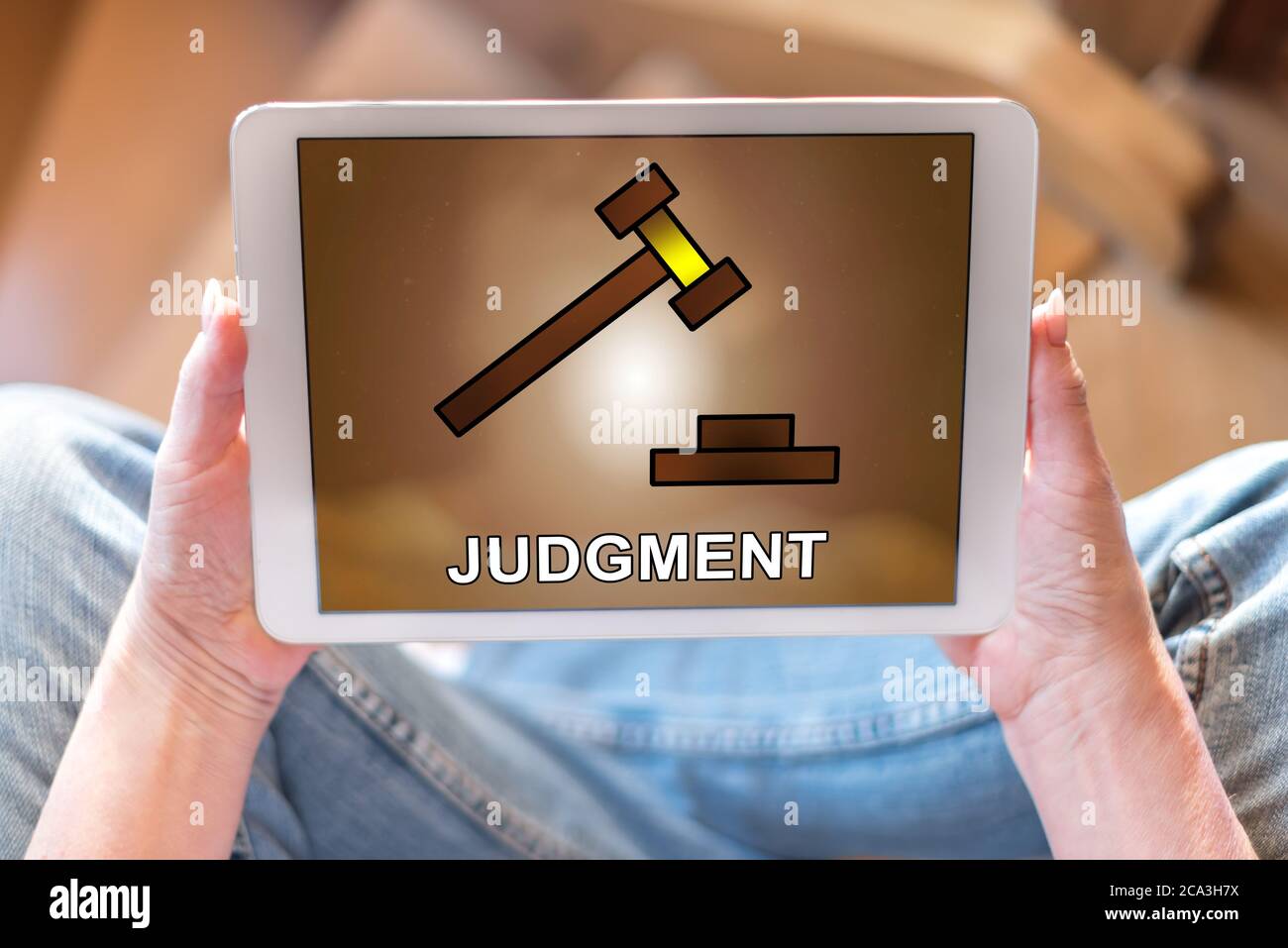 Tablet screen displaying a judgment concept Stock Photo - Alamy