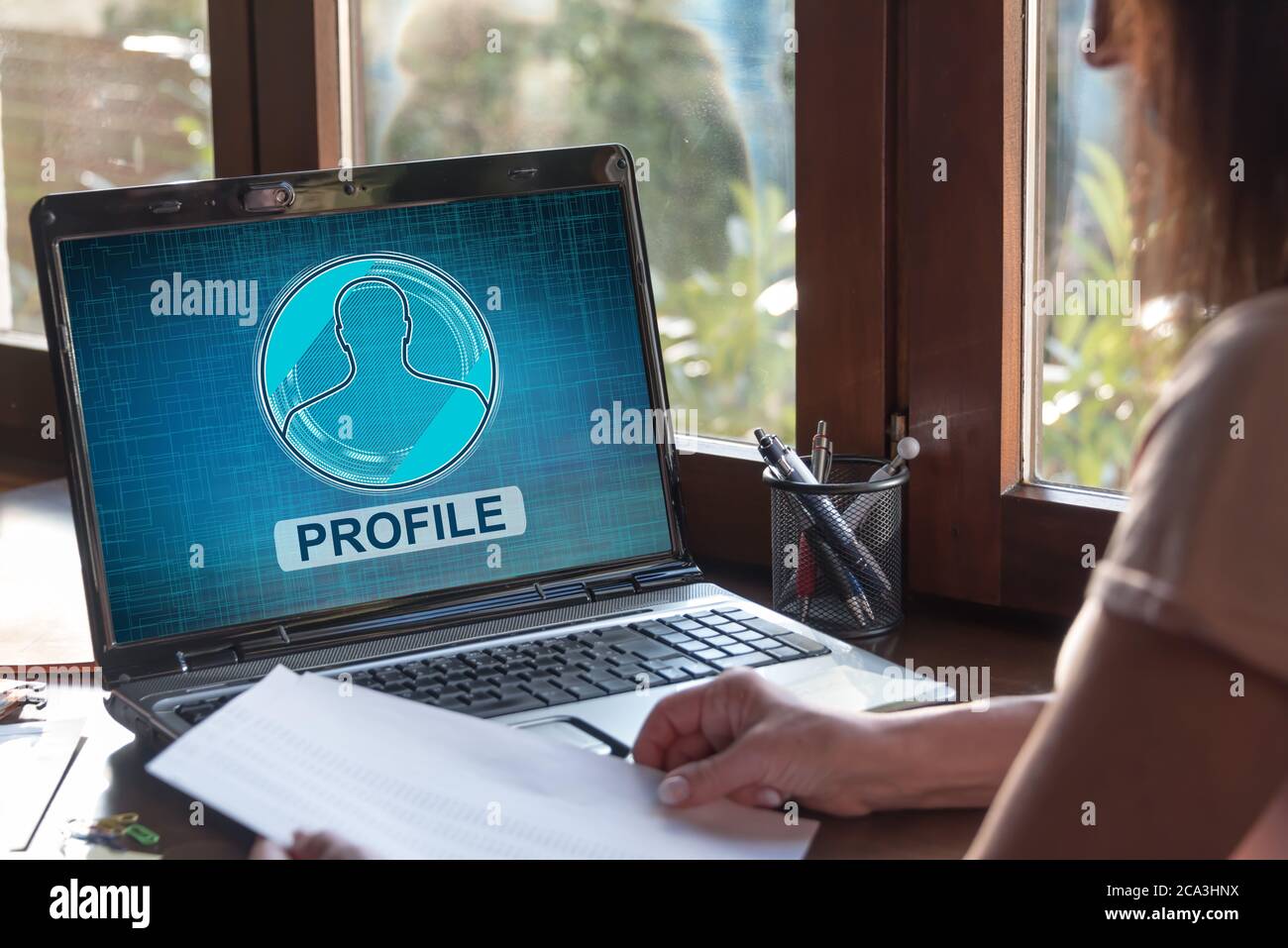 Laptop screen displaying a profile concept Stock Photo - Alamy
