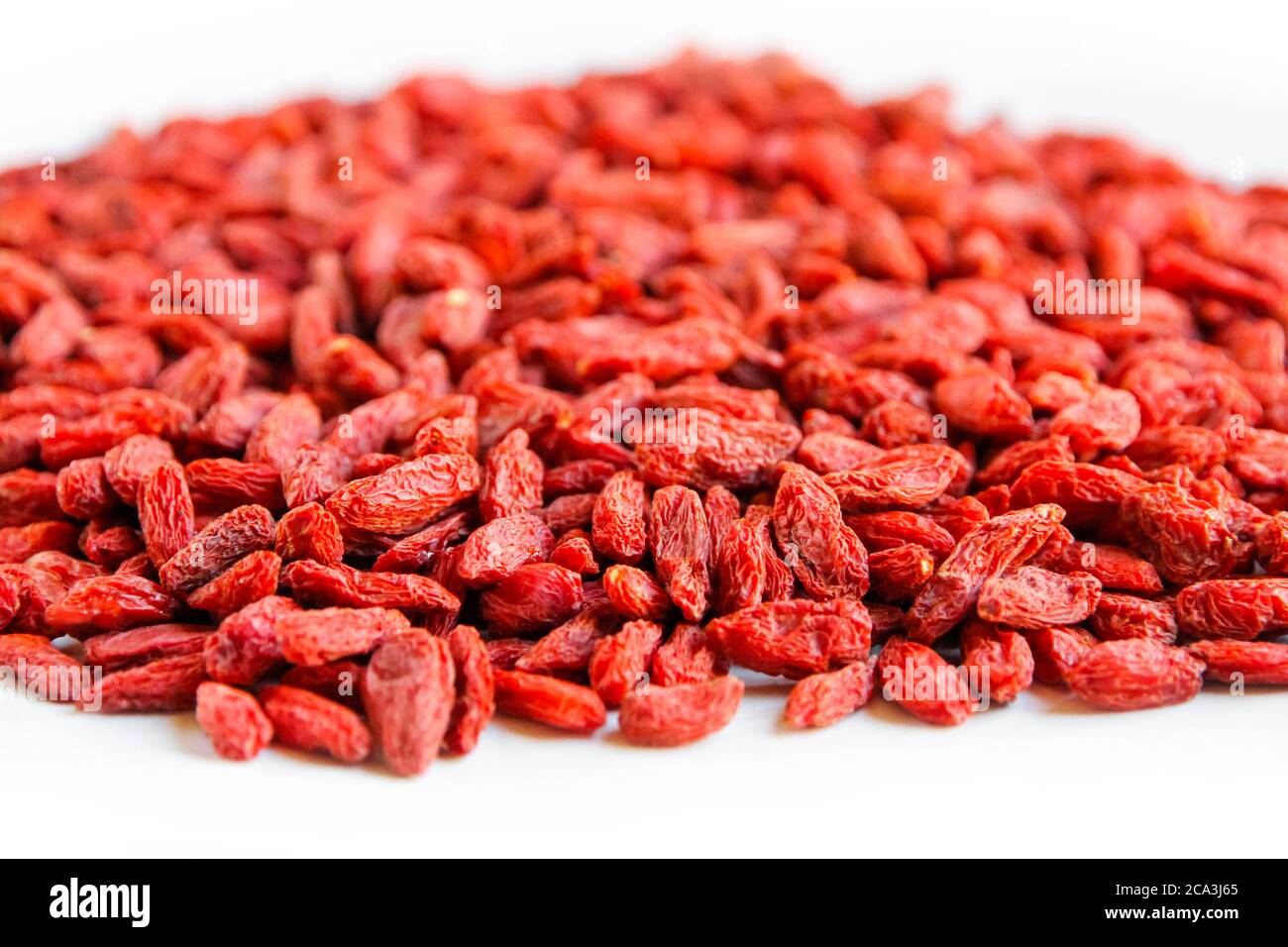 Goji berries isolated on a white background Stock Photo - Alamy