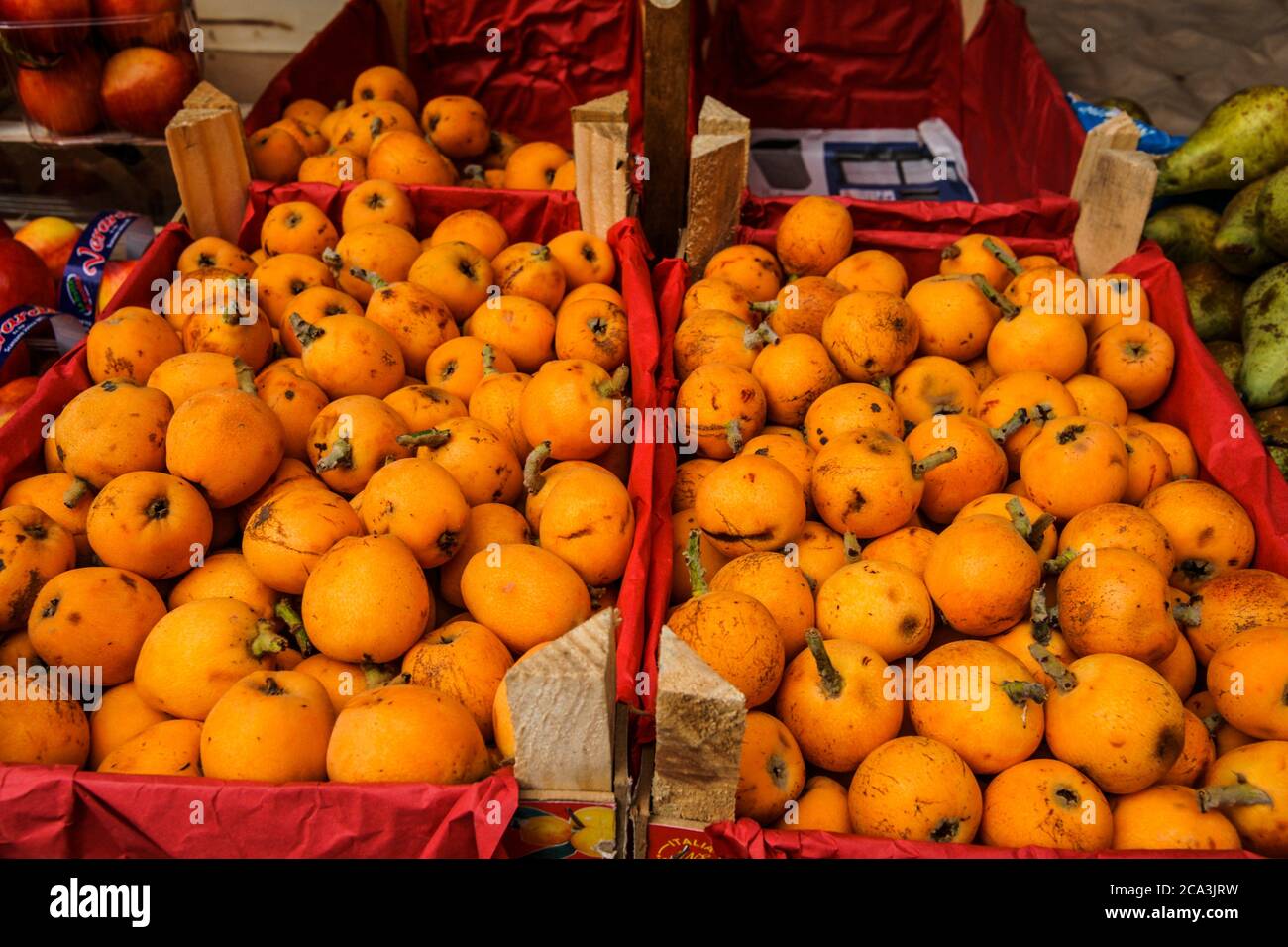 Loquat (Eriobotrya japonica) fruit stand. Nespole (Italian). The ...