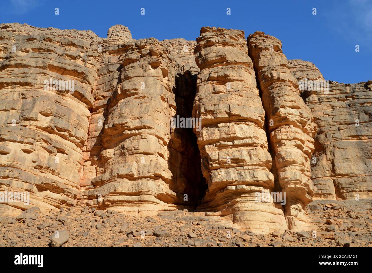 Algeria, Illizi, Tassili N'Ajjer National Park: sheer sandstone cliff ...