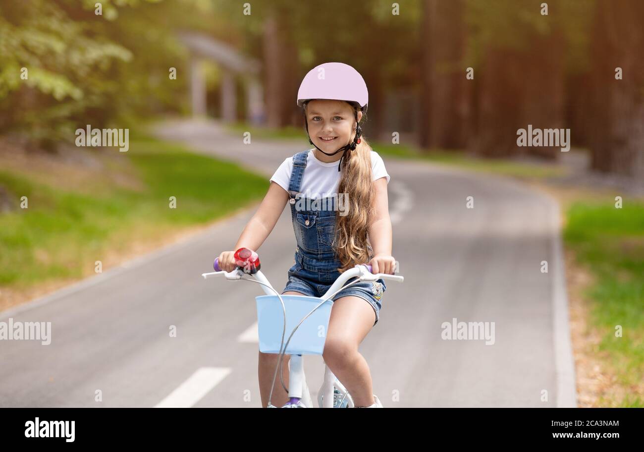 Girl riding bicycle hi-res stock photography and images - Alamy