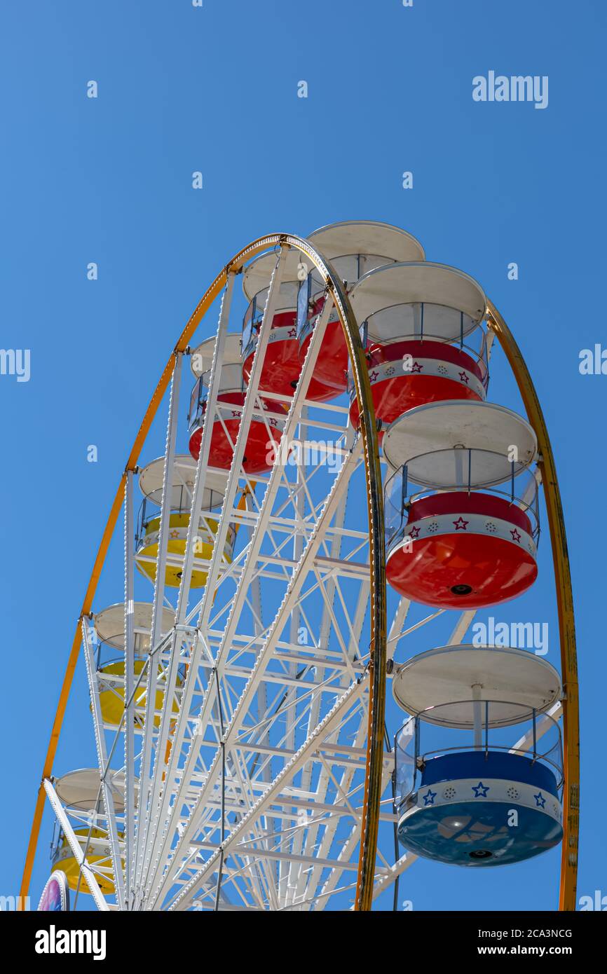Giant ferris wheel with chairs, metallic structure, recreational ...