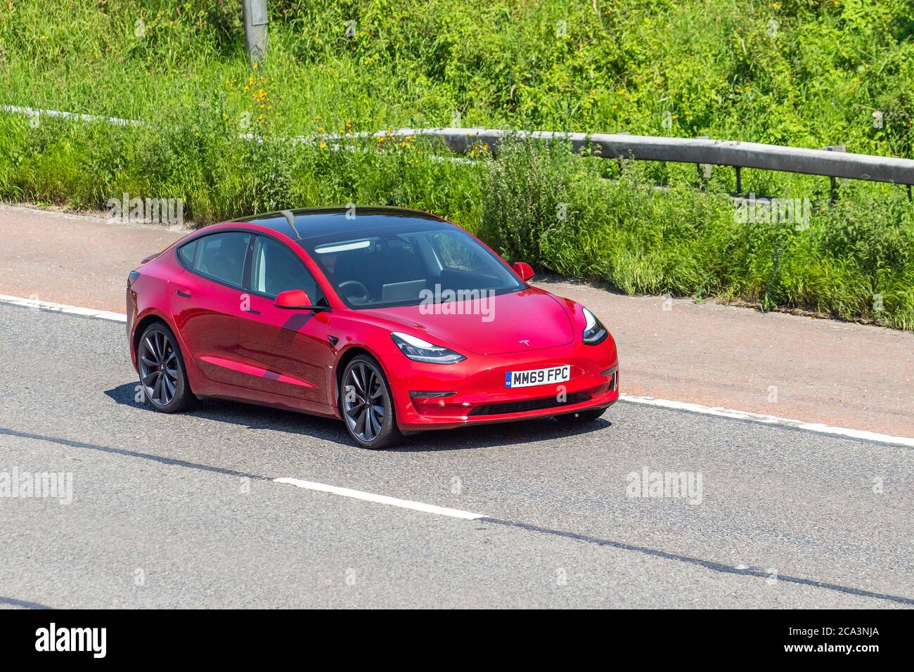 Tesla model 3 red hi-res stock photography and images - Alamy