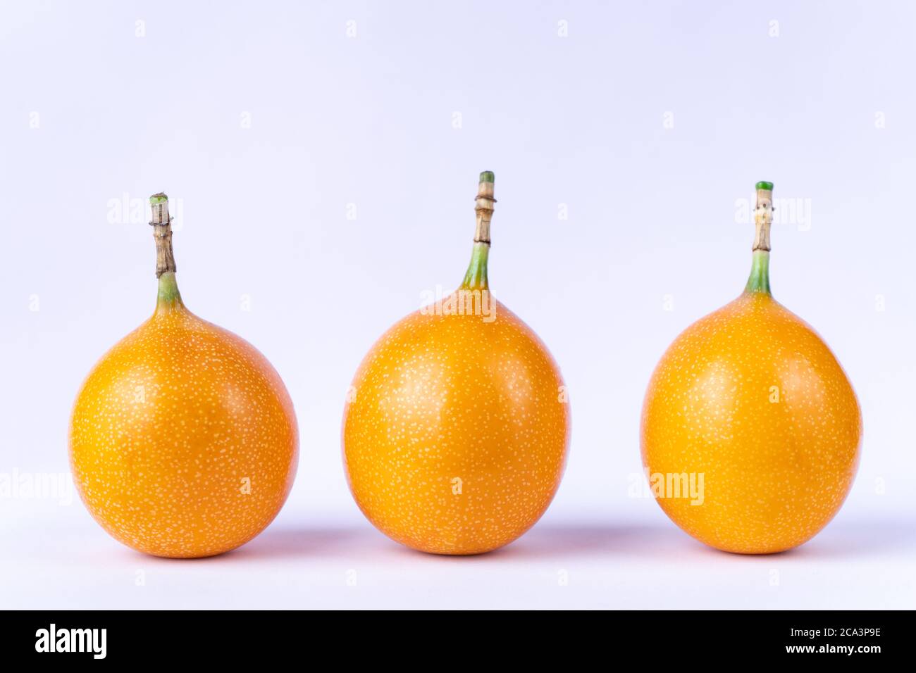 Image of ripe fresh granadilla on white background Stock Photo - Alamy
