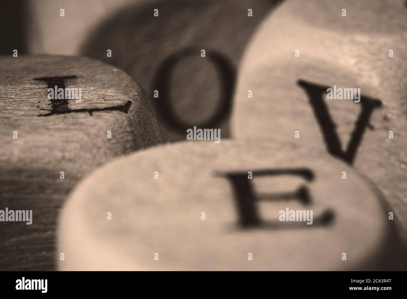 Small wooden blocks with letters spelling love. Concept: Love is ...