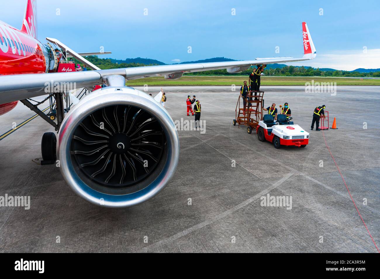 Airport technician team troubleshoot and repair a flap on a passenger ...