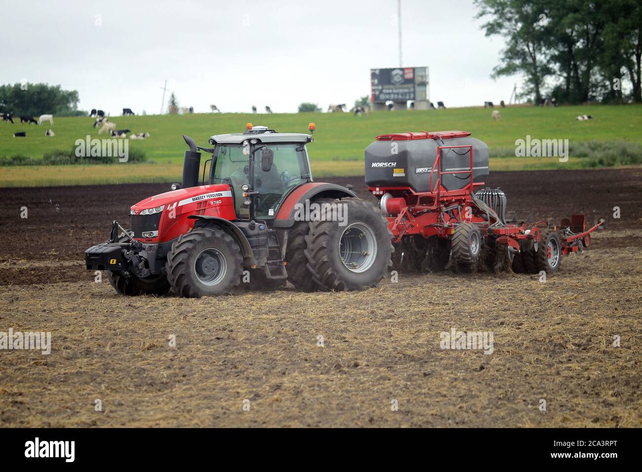 Farmer plowing the field Cultivating tractor in the field Red farm ...