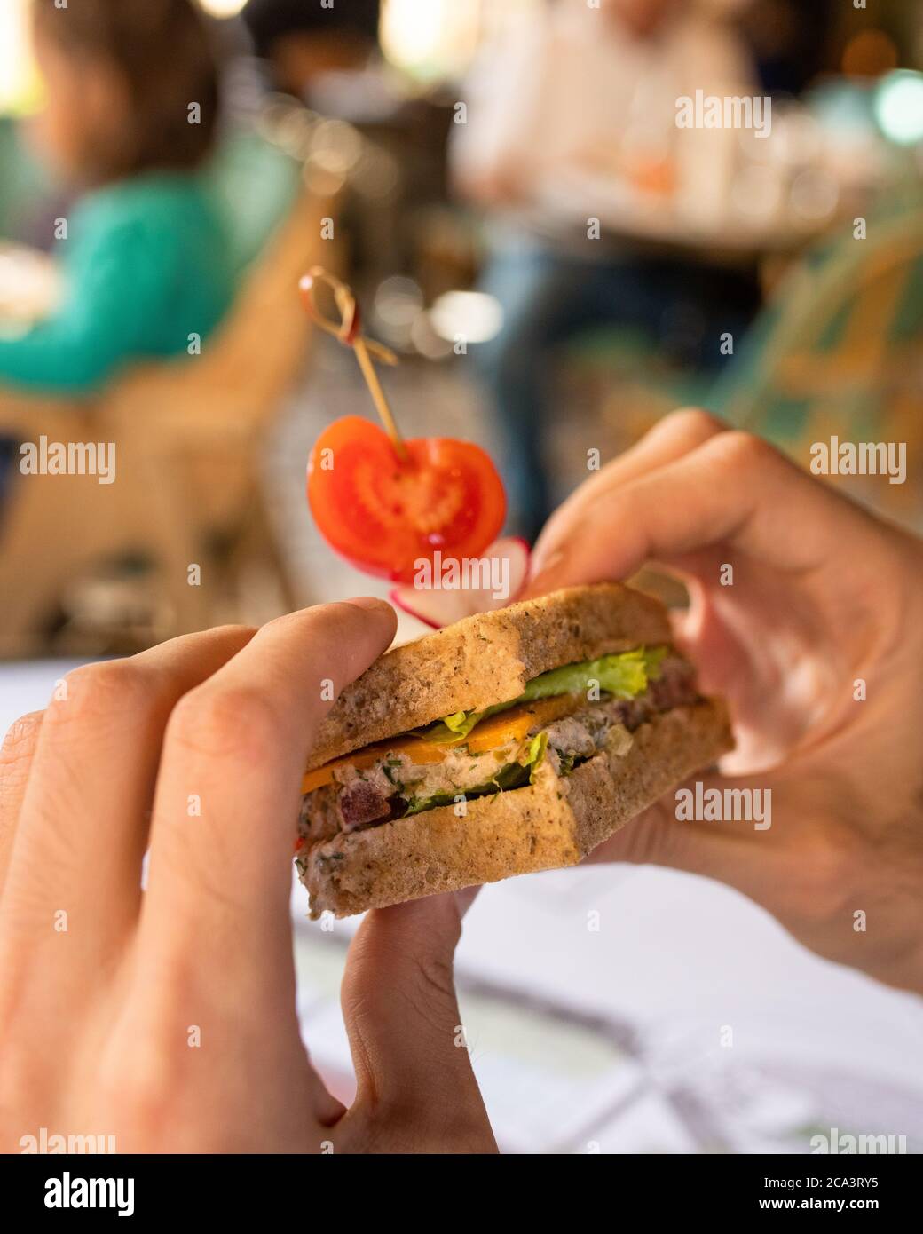 Eating cheese sandwich close up Stock Photo - Alamy