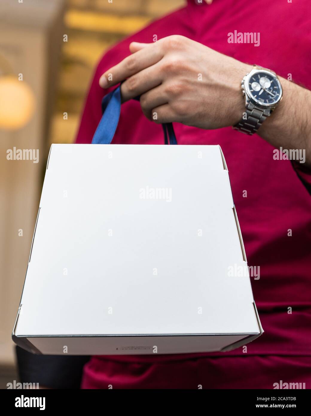 Man holding white box Stock Photo - Alamy