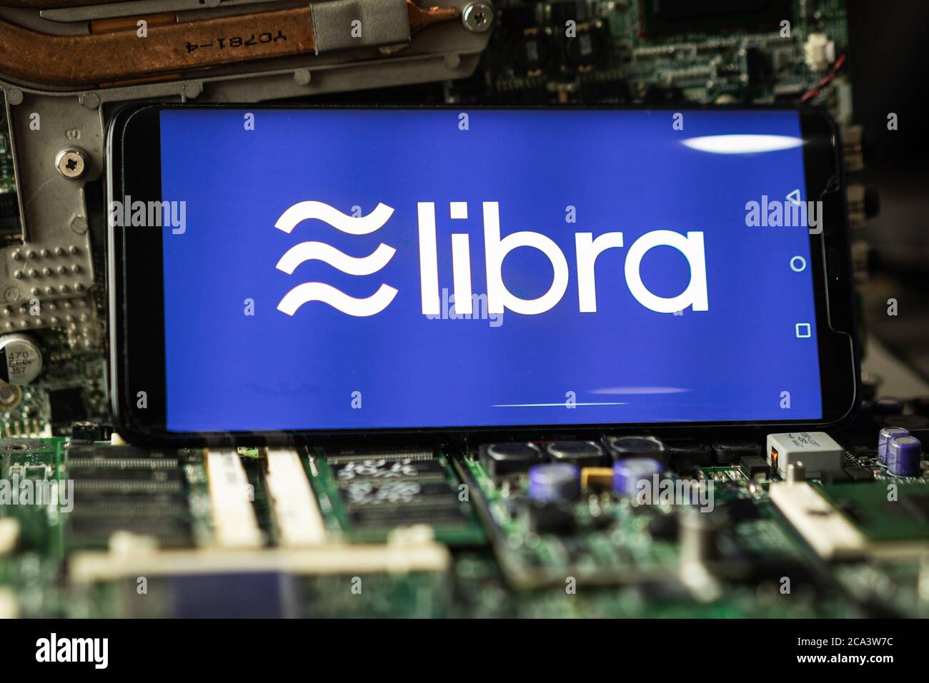 Phone shows Libra logo on the screen Stock Photo - Alamy