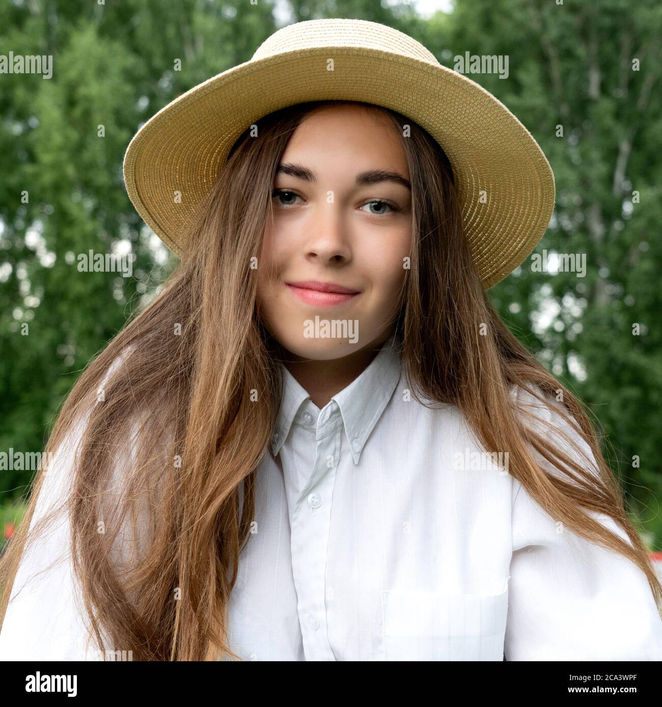Woman with long hair and a hat hi-res stock photography and images - Alamy