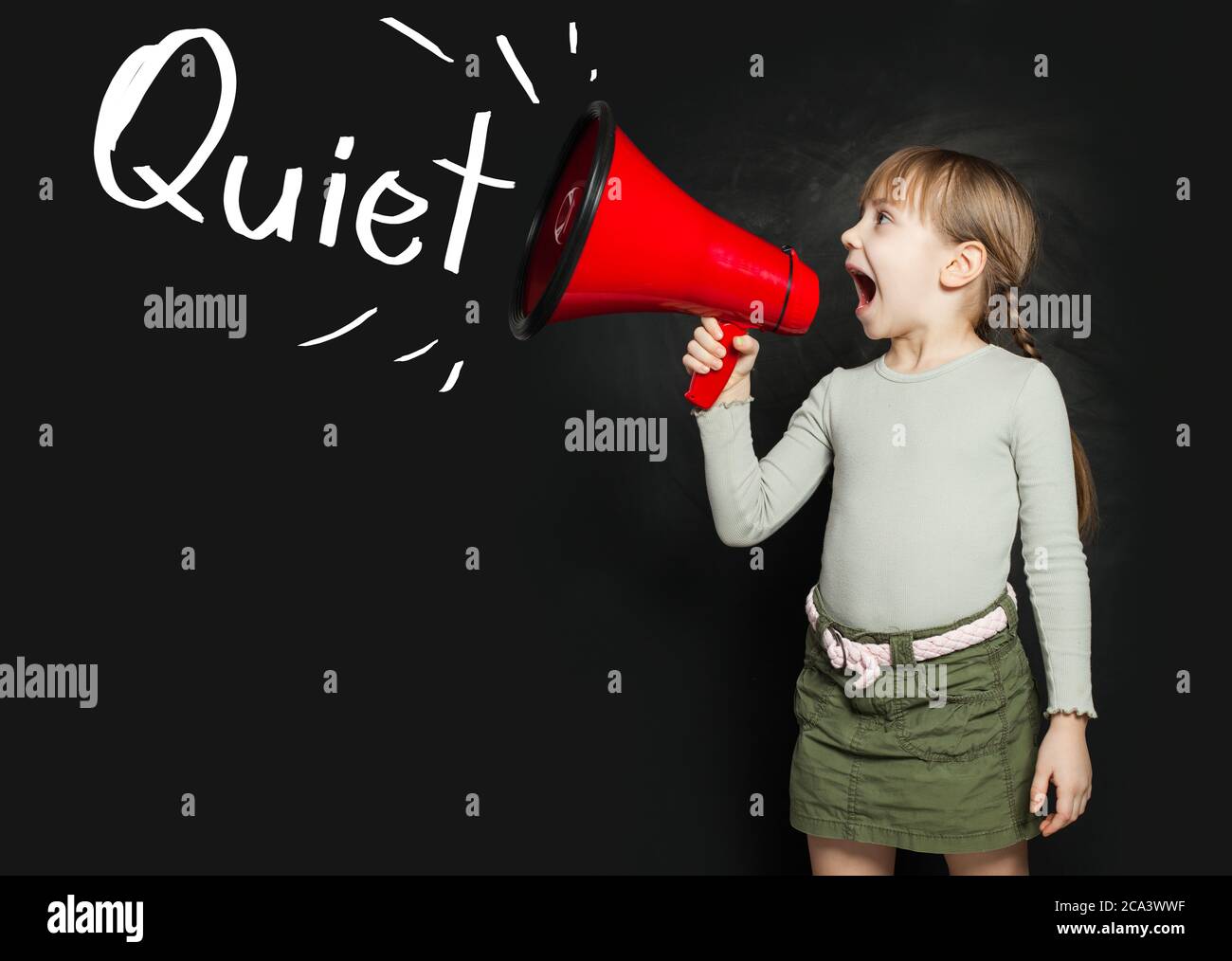 Cute small girl screaming through a megaphone be quiet! Stock Photo - Alamy