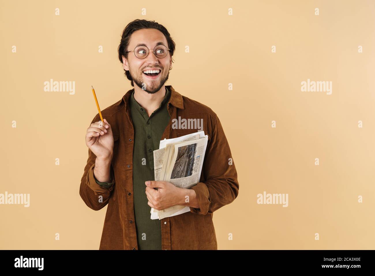 Image Of Joyful Surprised Man In Eyeglasses Holding Newspapers And