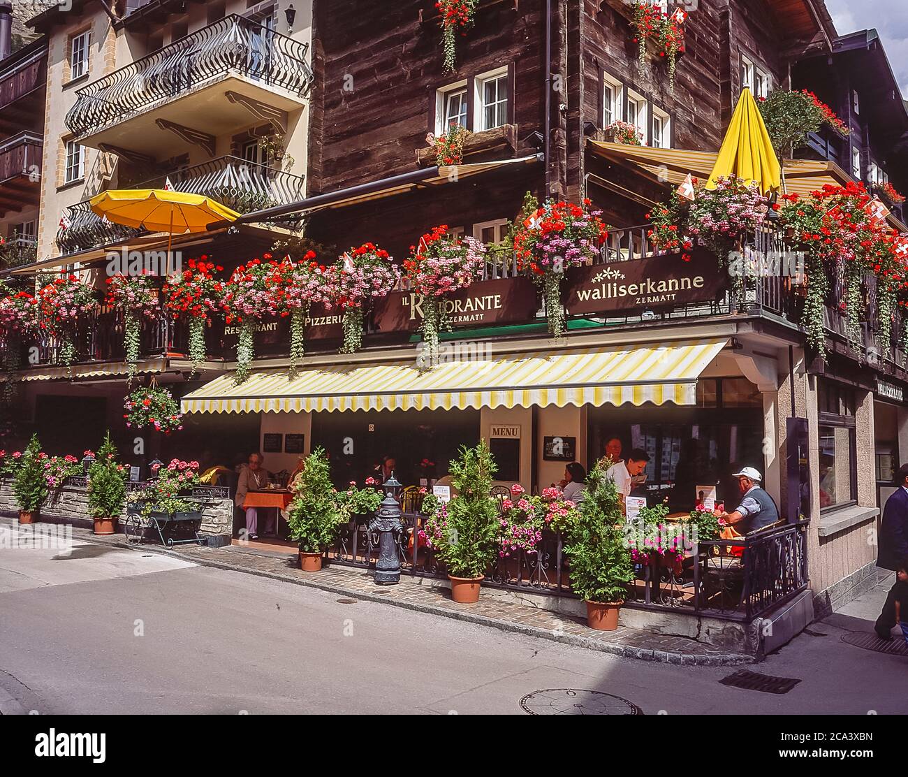 This street scene is on the main street of the Swiss mountain holiday ...