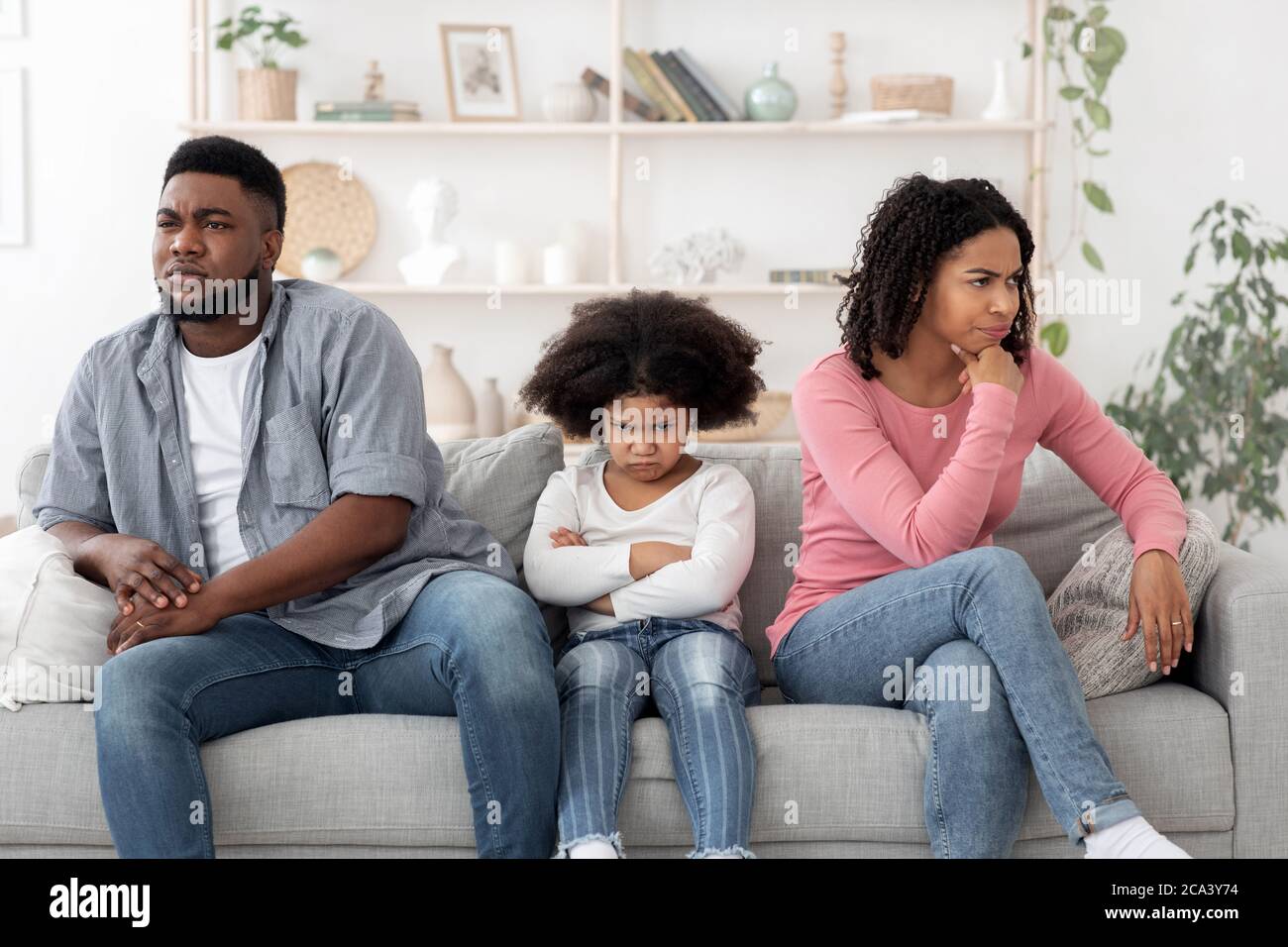 Family Misunderstanding. Black Parents And Little Daughter Ignoring ...