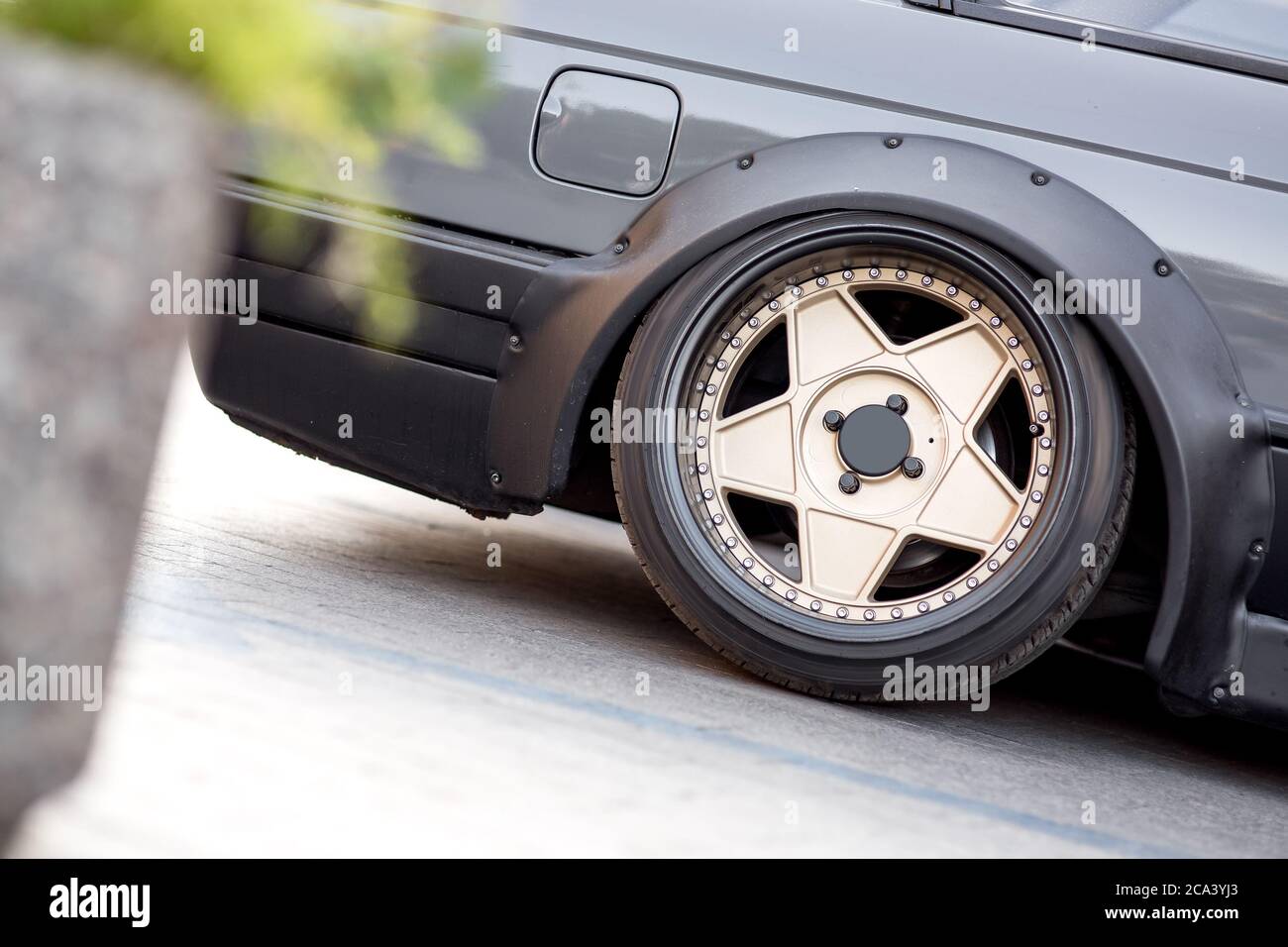 Low ride car tire with disc close up side view of the rear low profile ...