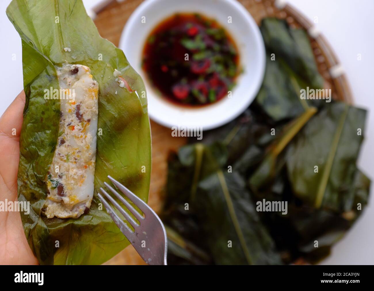 Top view people eating flat rice dumpling on tray food background, a ...