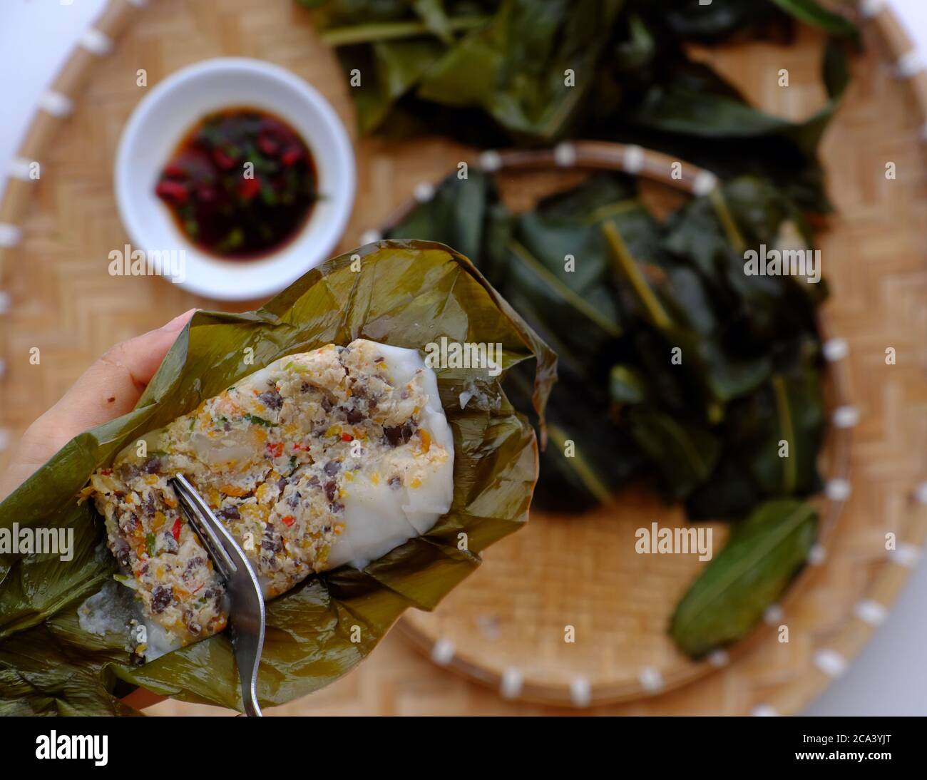 Top view people eating flat rice dumpling on tray food background, a ...