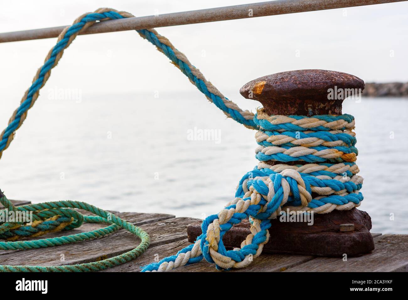 Mooring rope wrapped around a tie down point on the screwpile jetty on ...