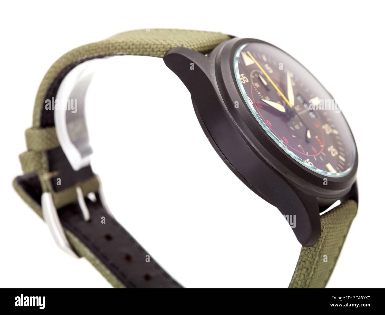 wristwatch with a green textile strap and dark brown iron case, side ...