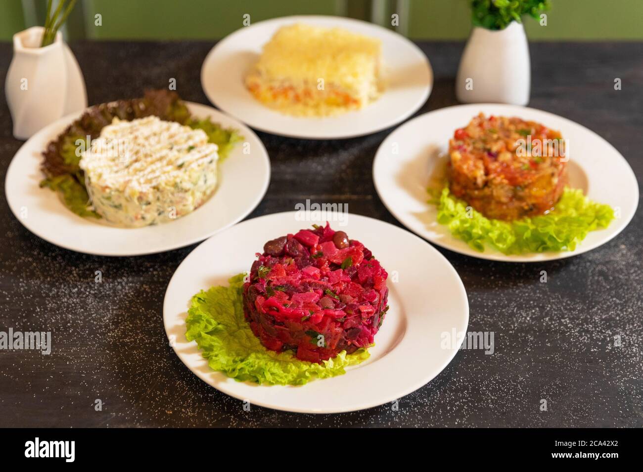 Tasty beetroot, eggplant, mimosa stolichny salad Stock Photo - Alamy