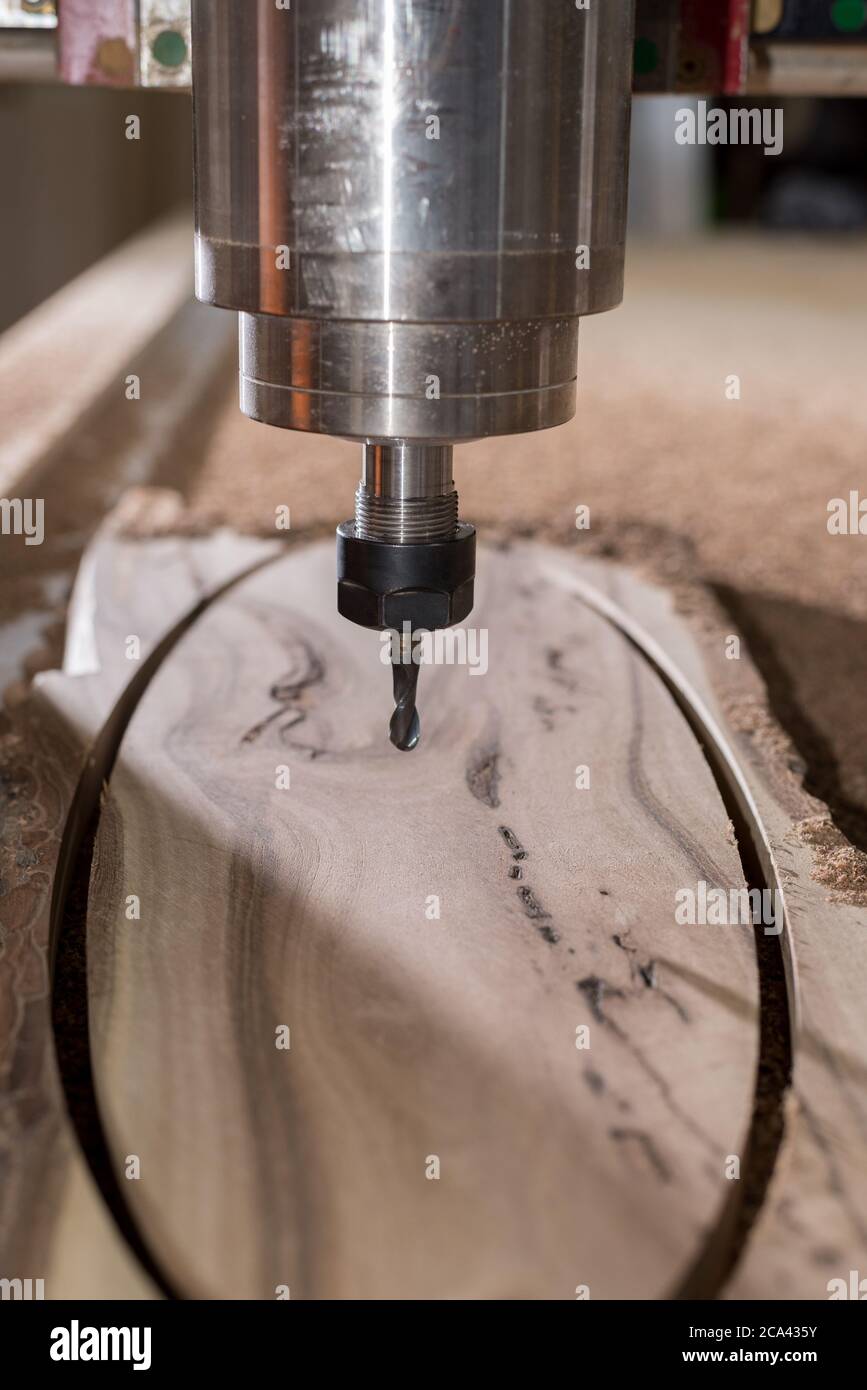 Woodwork cnc machine working on wood board. Machine tool at the wood ...