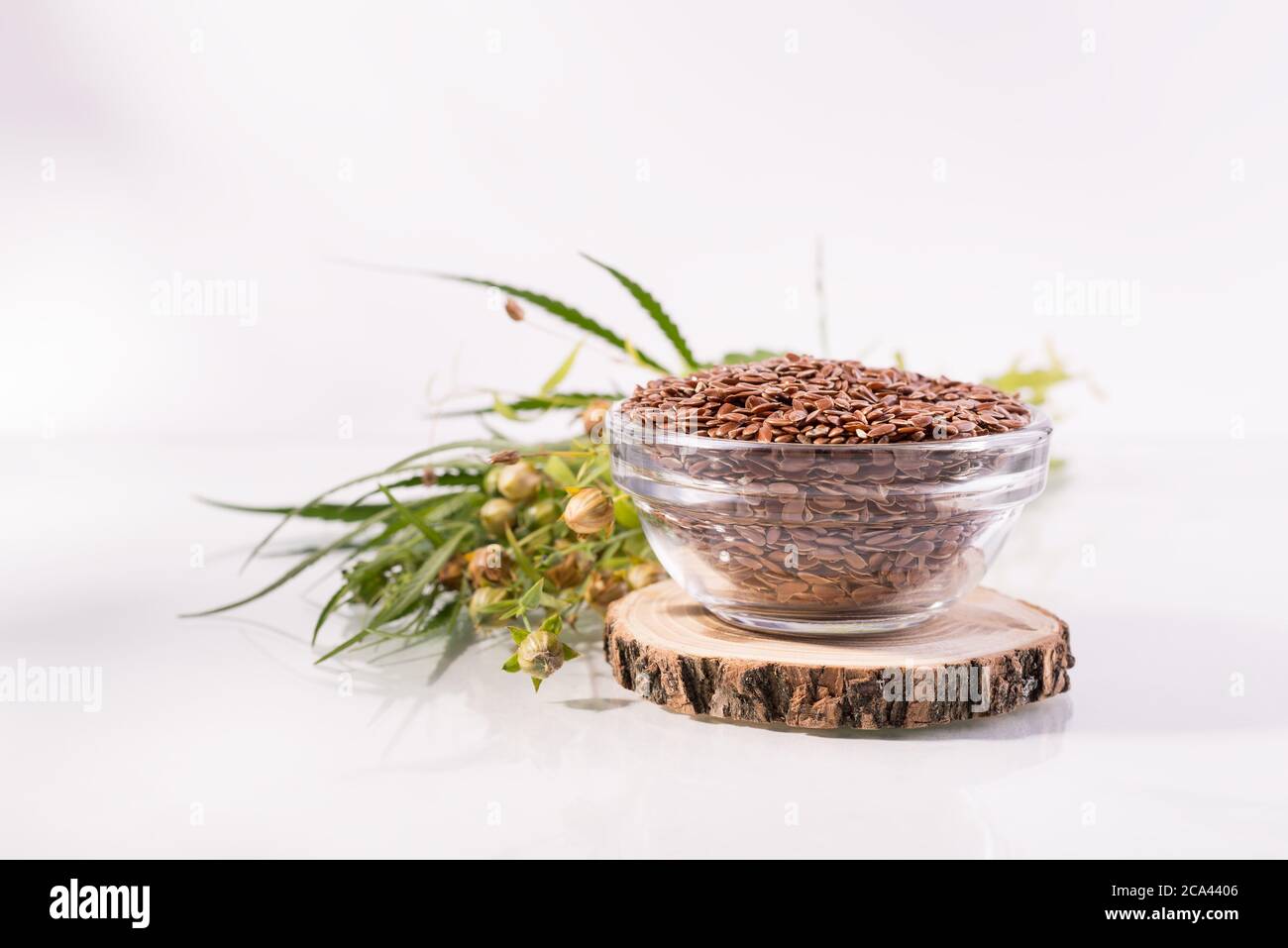 Close up Flax seeds in a glass bowl. Composition with , flax seeds, and ...