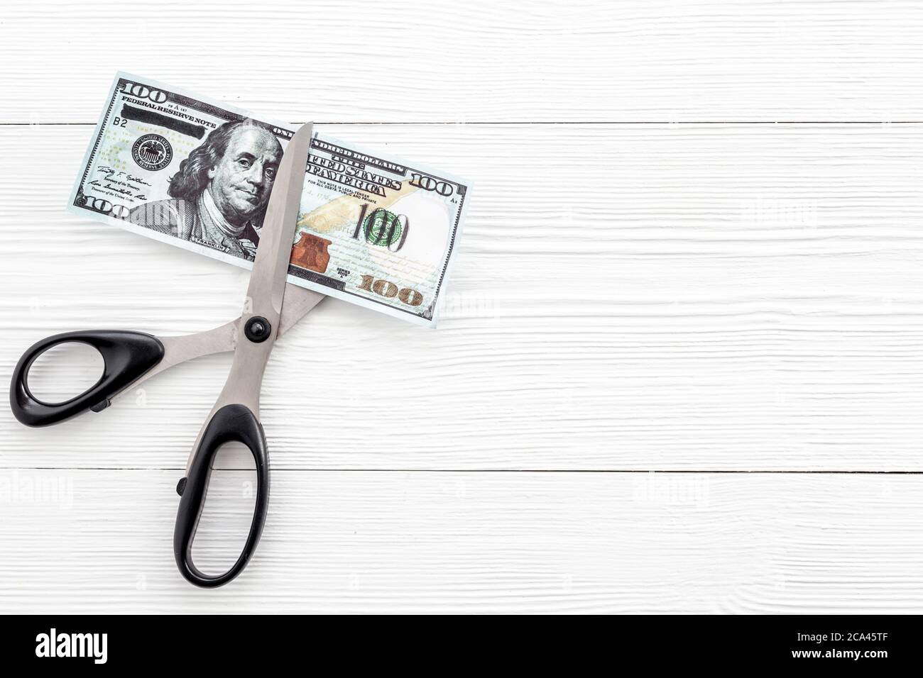 Decline of dollar exchange rate. Scissors cut dollars banknote Stock ...