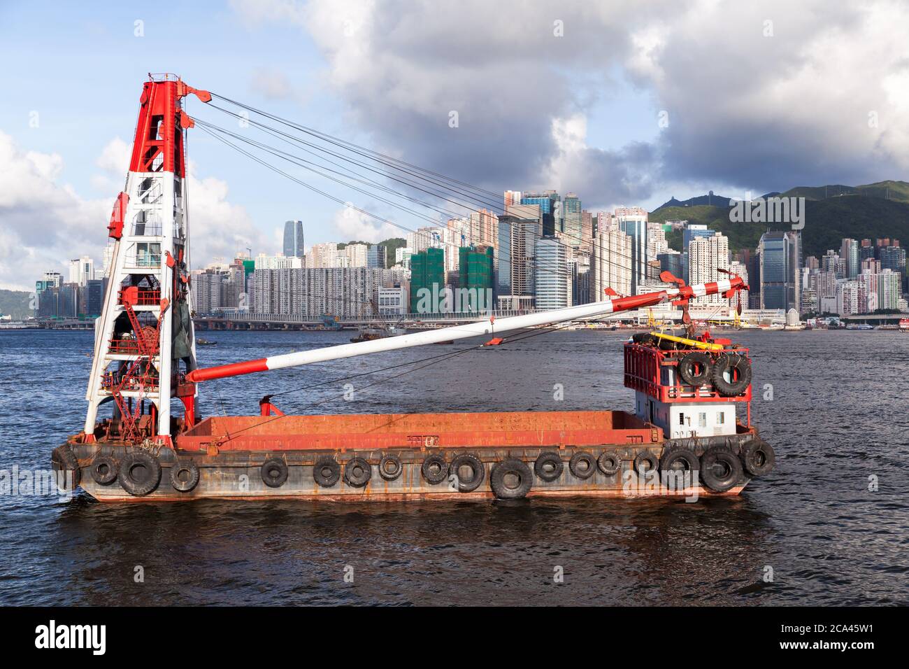 Floating crane are in Hong Kong bay at sunny day Stock Photo - Alamy