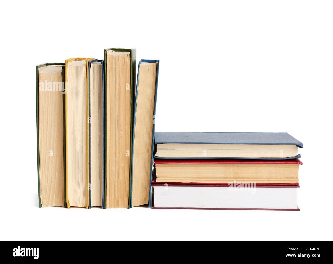 stack of various books, items are isolated on white background, close ...