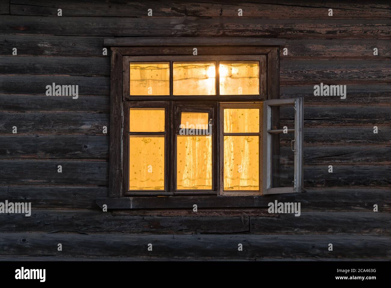 Window of the wooden ancient house at night time Stock Photo - Alamy