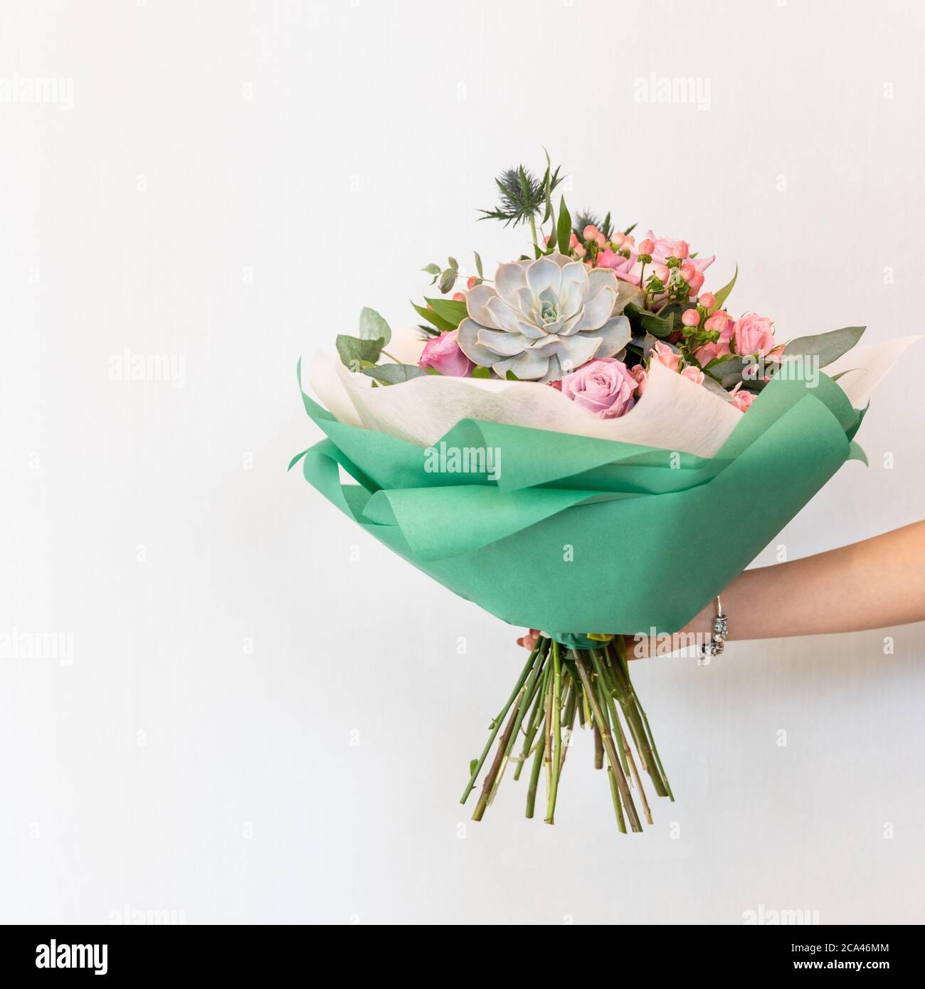 Woman holding colorful flower bouquet with white background Stock Photo ...